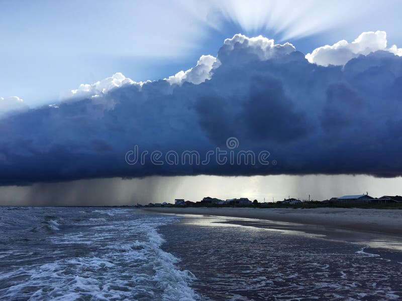 Pouring Rain from and Sunshine on Top of Cloud at the Same Time. Stock ...