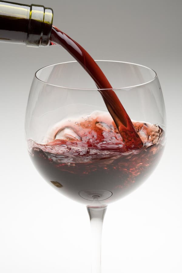 Pouring red wine stock image. Image of splash, splashing - 18289407