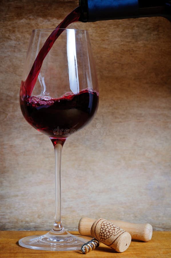Pouring Red Wine stock image. Image of drink, bottle, isolated - 196739