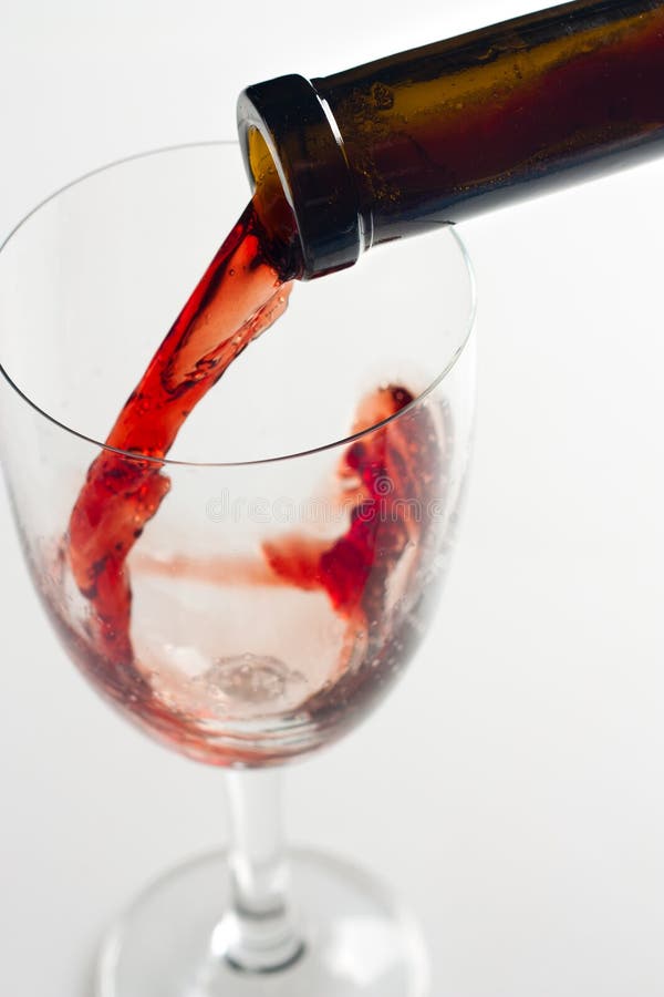 Pouring red wine stock photo. Image of drink, glass, liquid - 23329856