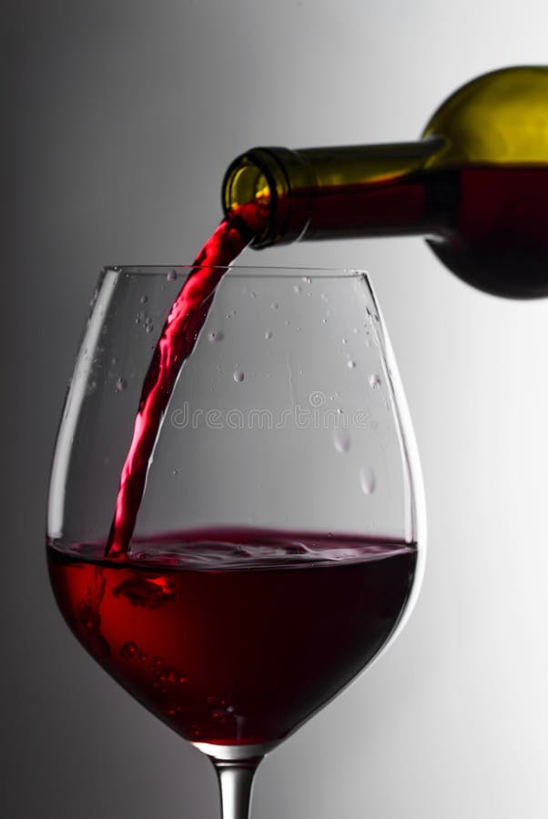 Pouring red wine. stock photo. Image of liquor, liquid - 106762854