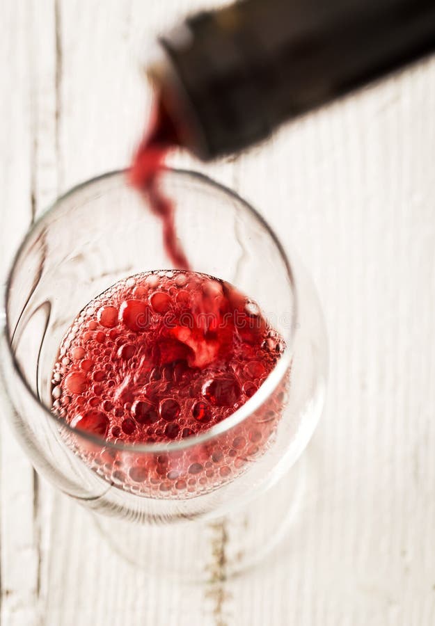 Pouring Red Wine into the Glass Cup Stock Photo - Image of flow, vine ...