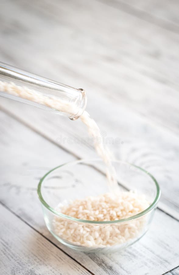 Pouring rice from hand stock photo. Image of cereal, hand - 27234568