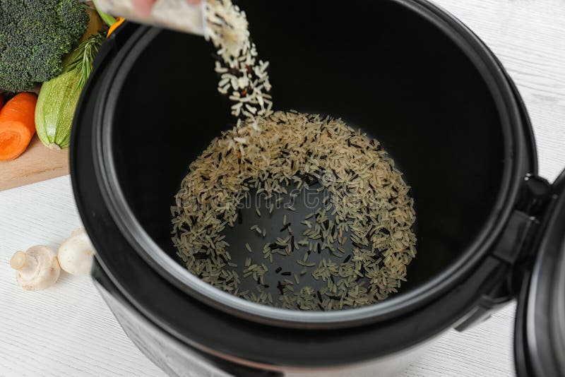 Pouring Rice into Modern Multi Cooker Stock Image - Image of closeup ...