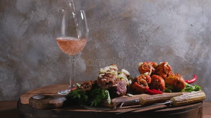 Pouring Rose Wine into Glass in Garden on Sunny Day, Closeup ...