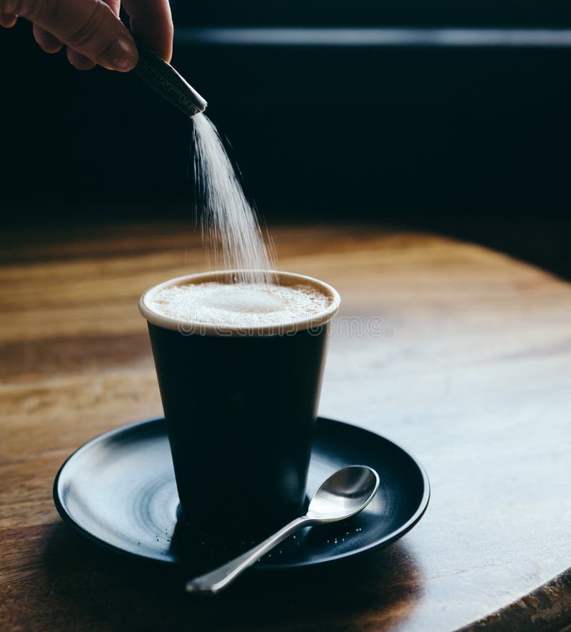 Pouring a Sachet of Sugar into a Cafe Latte Stock Photo - Image of ...