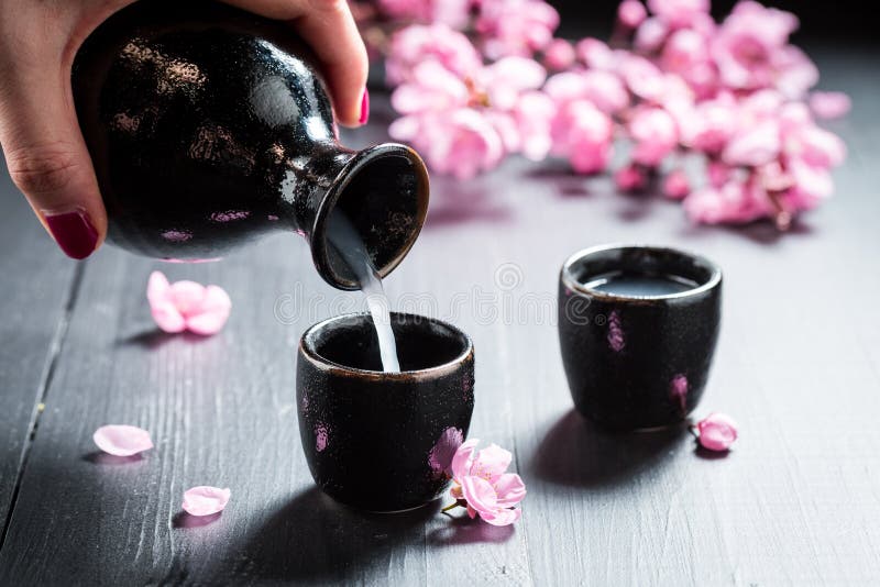 Pouring sake stock image. Image of carafe, drink, container - 9935991