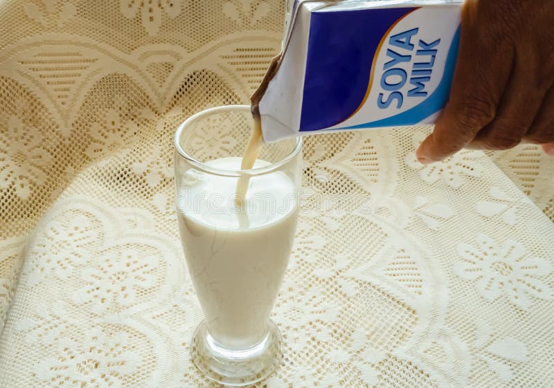 Pouring Soya Milk Beverage into Drinking Glass Stock Photo - Image of ...