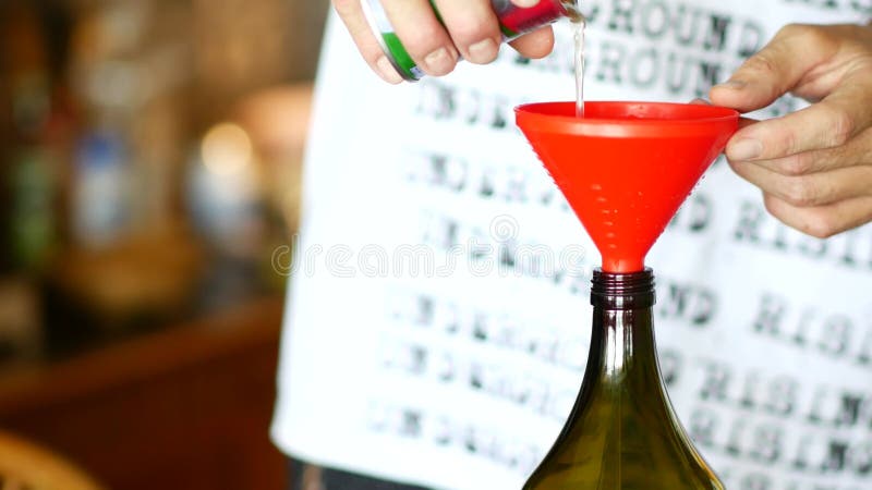 Pouring Syrup from Can into Bottle through Funnel Stock Video - Video ...