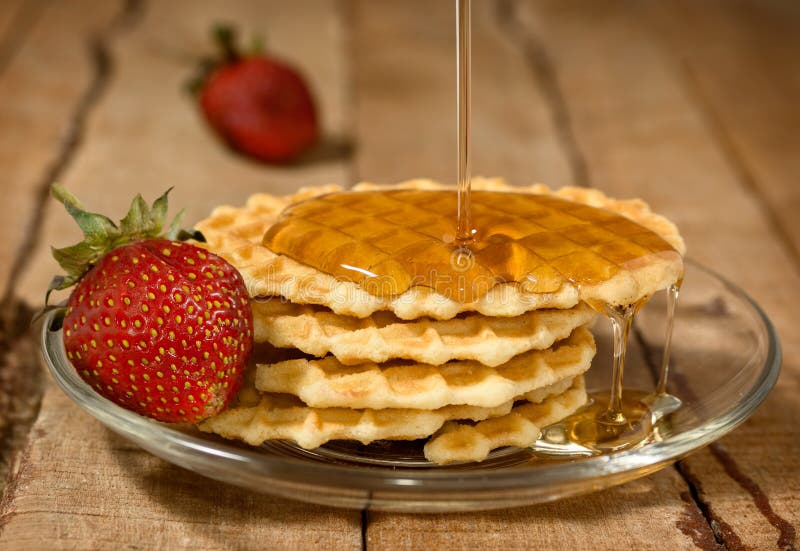 Pouring syrup on waffles stock image. Image of waffles - 64579947