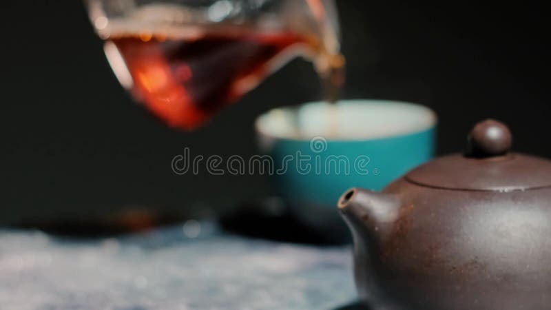 Pouring Tea into a Bowl. Chinese Tea Ceremony. Ceramic Kettle. Close-up ...