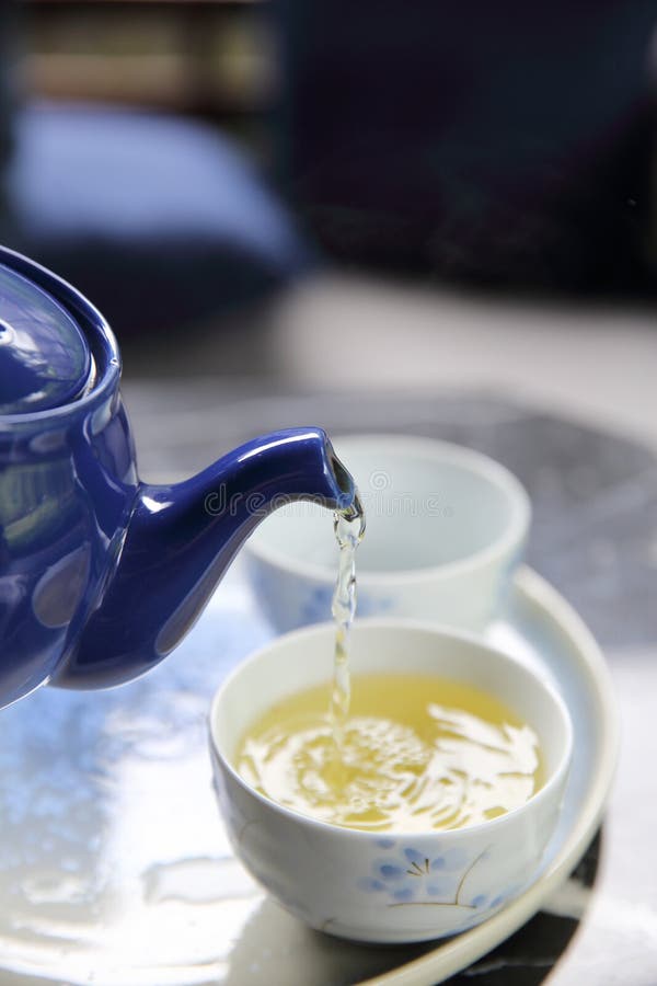 Pouring Tea into Cup of Tea in Close Up Chinese and Japan Drink Stock ...