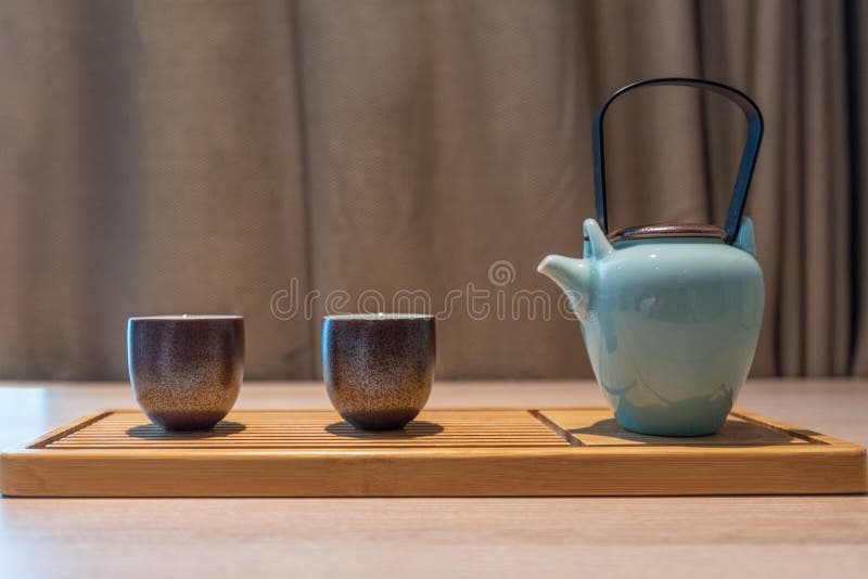 Pouring Tea from a Teapot into a Cup on the Table Stock Image - Image ...