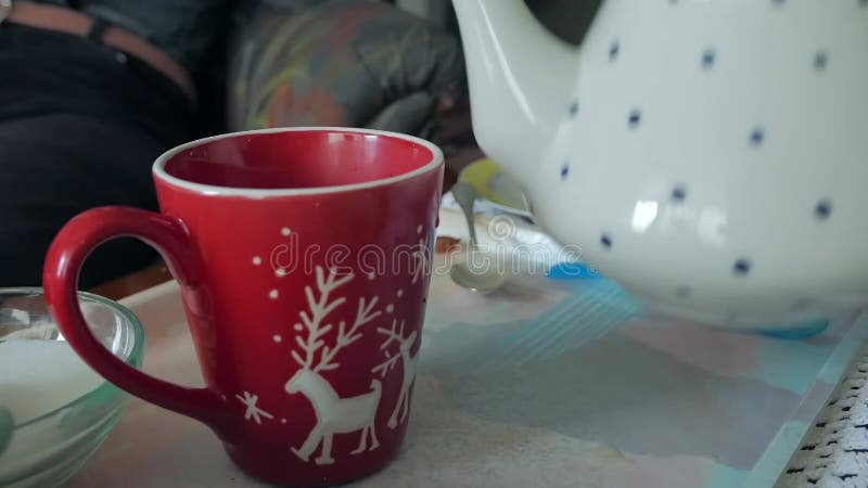 Pouring tea in red cup stock video. Video of drink, teapot - 208551721