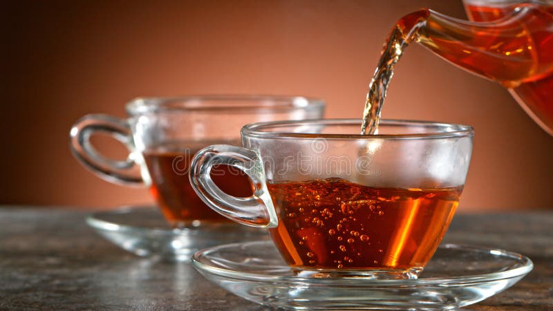 Pouring tea to a teacup stock image. Image of restaurant - 210855877