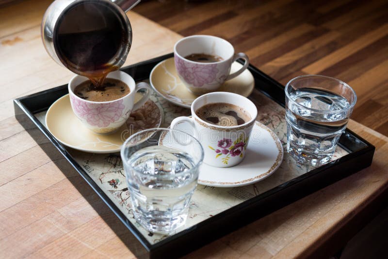 Pouring Turkish Coffee Served with Water in Tray. Stock Image - Image ...