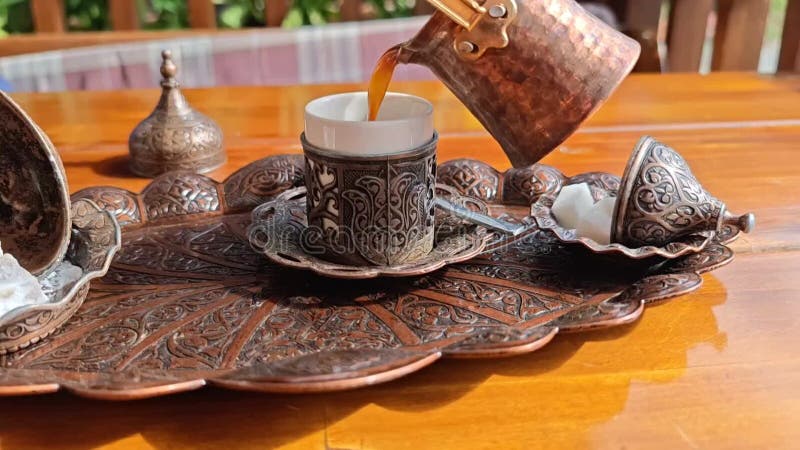 Pouring Turkish Coffee from a Traditional Coffee Set at the Beginning ...