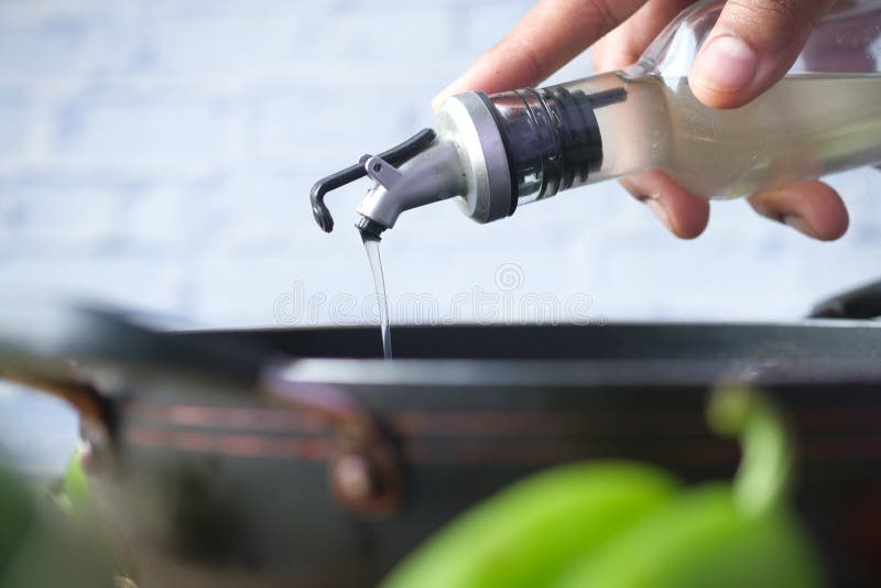 Pouring Vegetable Oil into Frying Pan. Stock Image - Image of ...
