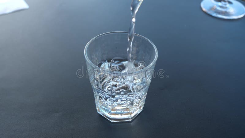 Pouring Water from a Bottle into a Glass Stock Video - Video of water ...