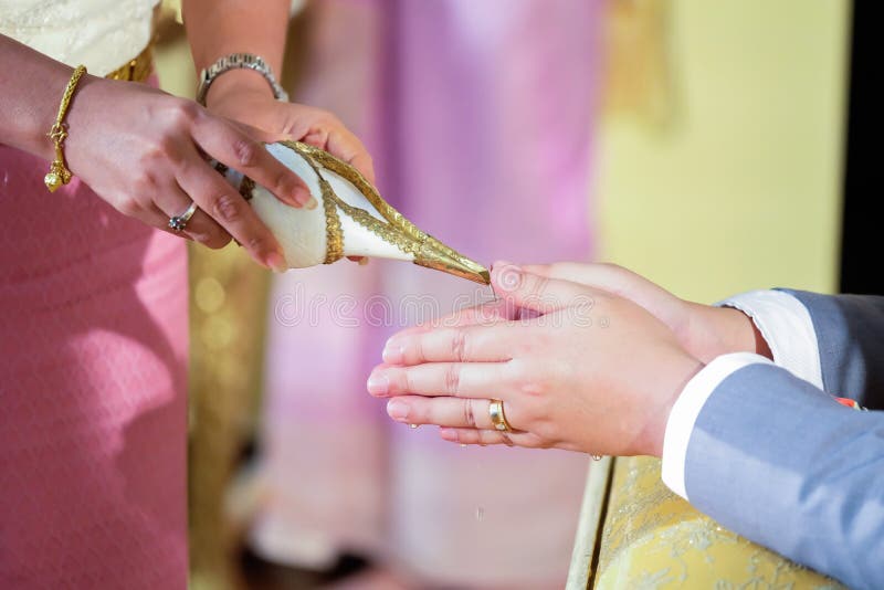 Pouring Water from the Conch Shell into the Bride Hands at a T Stock ...