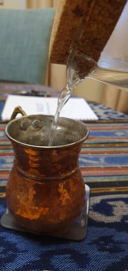 Pouring Water in a Copper Jug Stock Image - Image of pouring, fresh ...