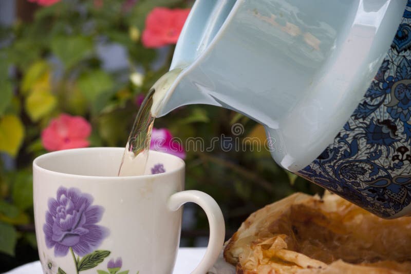 Pouring water into teacup stock image. Image of pouring - 16159663