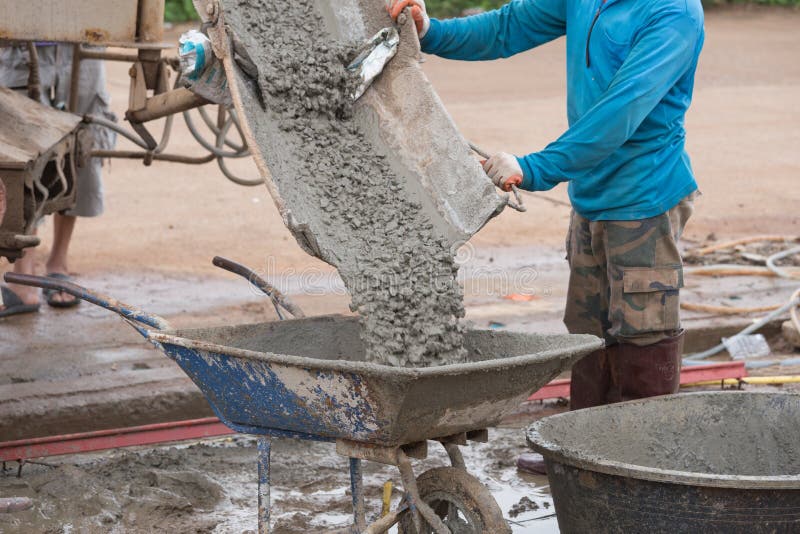 Pouring wet cement to cart stock photo. Image of cart - 74899510