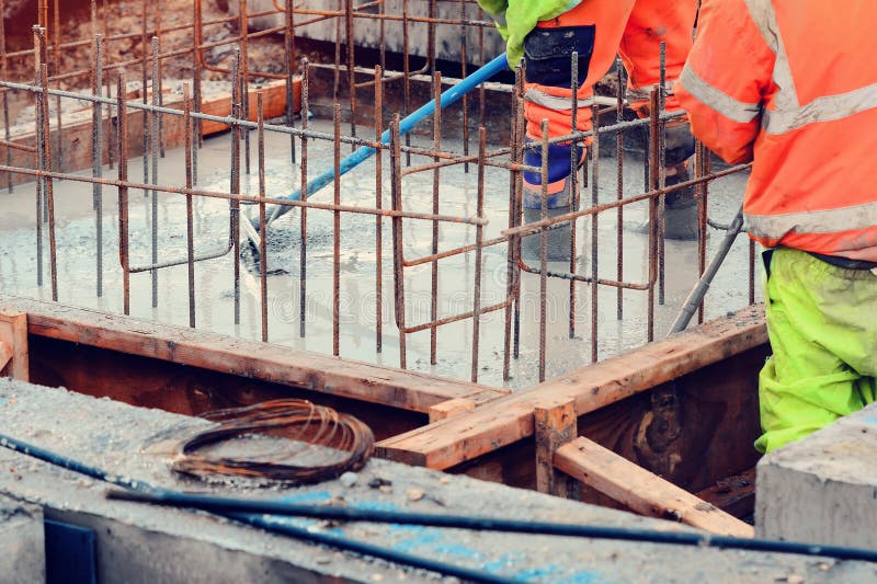 Pouring Wet Ready-mix Concrete into Lift Pit Base and Levelling it ...