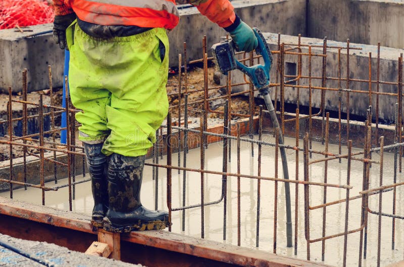 Pouring Wet Ready-mix Concrete into Lift Pit Base and Levelling it ...