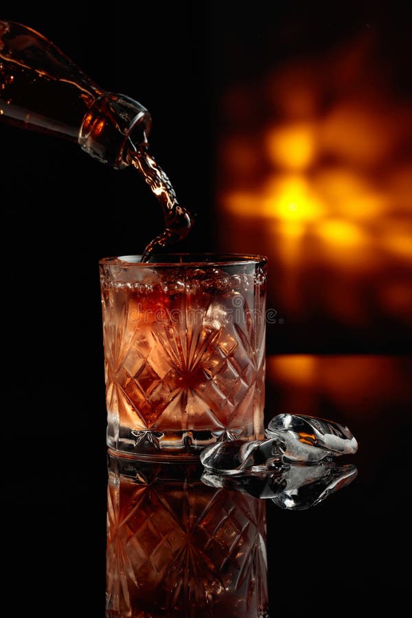 Pouring Whiskey into a Glass with Ice Stock Photo - Image of whisky ...