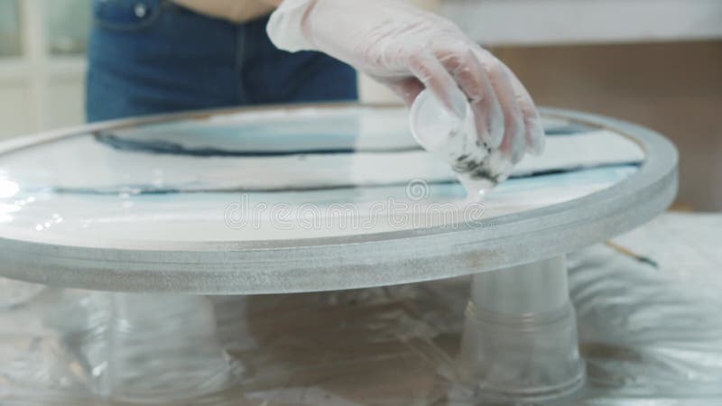Pouring White Epoxy Paint on the Surface of the Art Object Stock ...