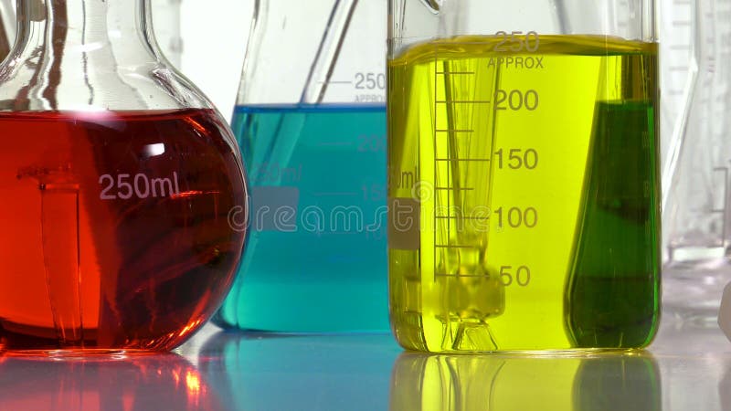 Pouring Yellow Liquid in a Beaker Using an Erlenmeyer Stock Video ...