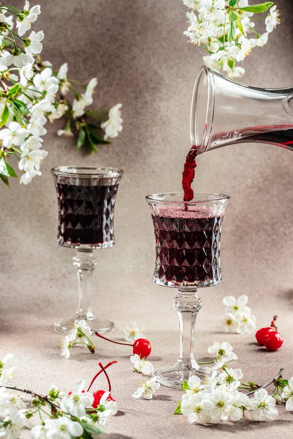 Pours Cherry Liqueur into a Glass, Berry Alcoholic Drinks Concept Stock ...