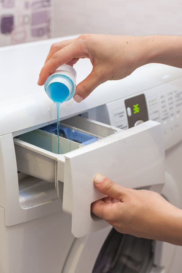 She Pours the Liquid Powder in Washing Machine. Stock Photo - Image of ...