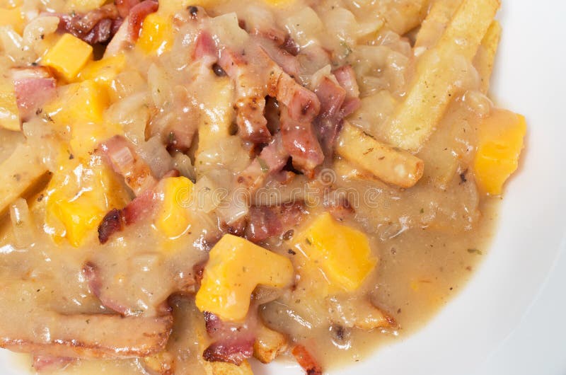 Poutine With Yellow Cheddar Cheese And Bacon Stock Photo - Image of ...