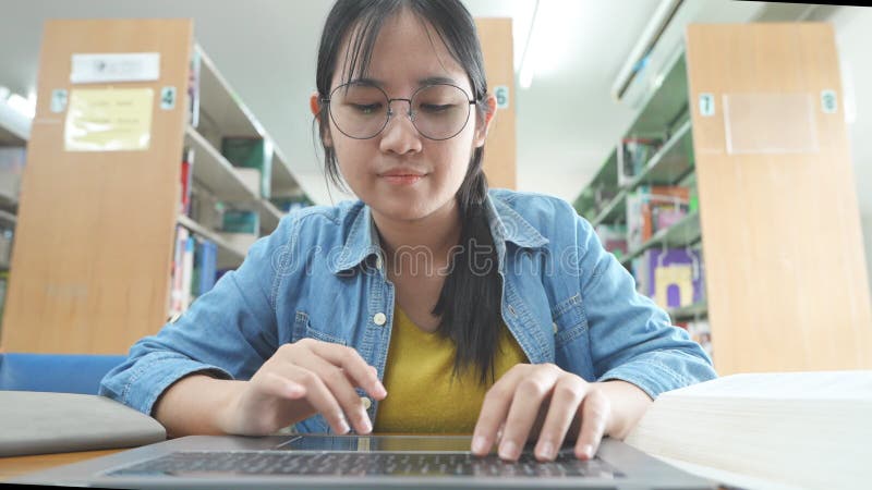 Young Woman Work on Laptop Computer Typing Point of View at University Library Stock Video ...