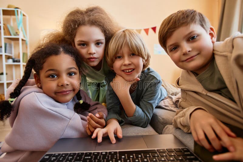 POV Group of Children Looking at Computer Screen Together Stock Photo ...