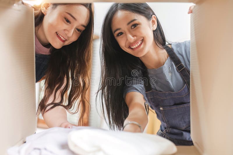 POV. Young Couple Picking Up Parcels in Parcel Boxes that are Being ...