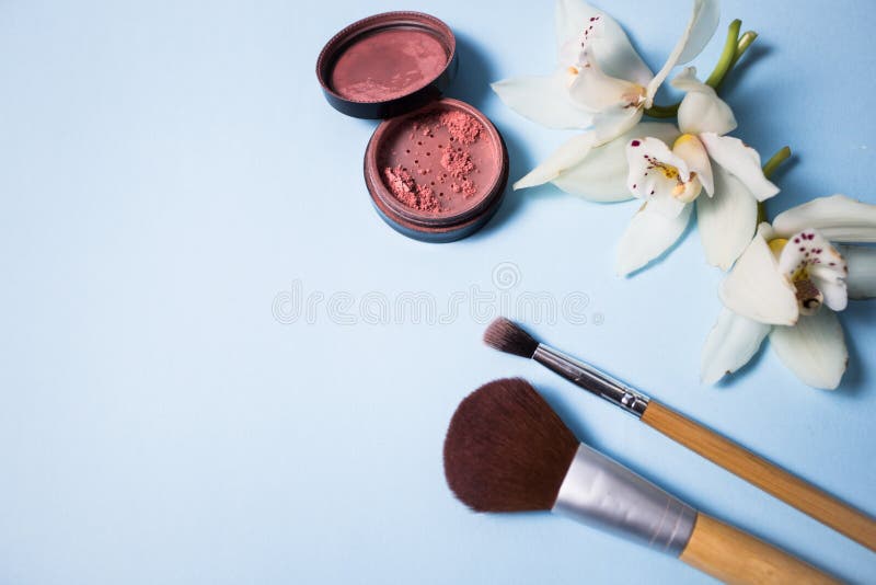 Powder, Brush and Flower on a Blue Background Stock Photo - Image of ...