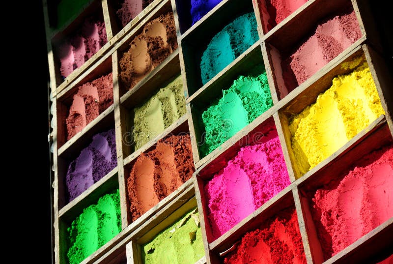 A Very Bright Colored Paint Powders in a Cardboard Box with a Spoon for ...