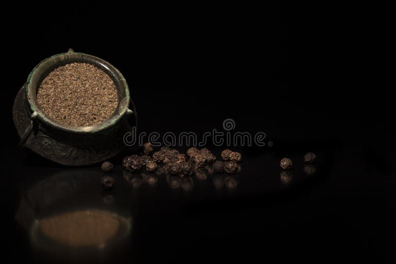 Powdered Black Pepper and Pepper Corns on Black Stock Image - Image of ...