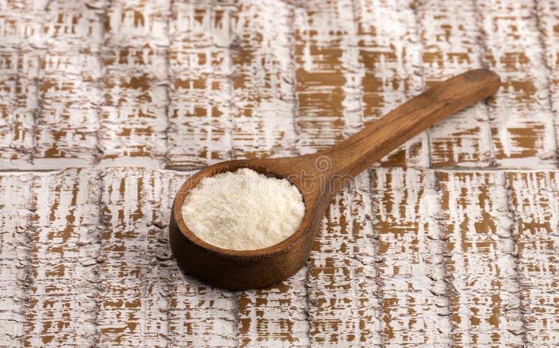 Powdered Milk with Nutrients in the Wooden Spoon Stock Photo - Image of ...