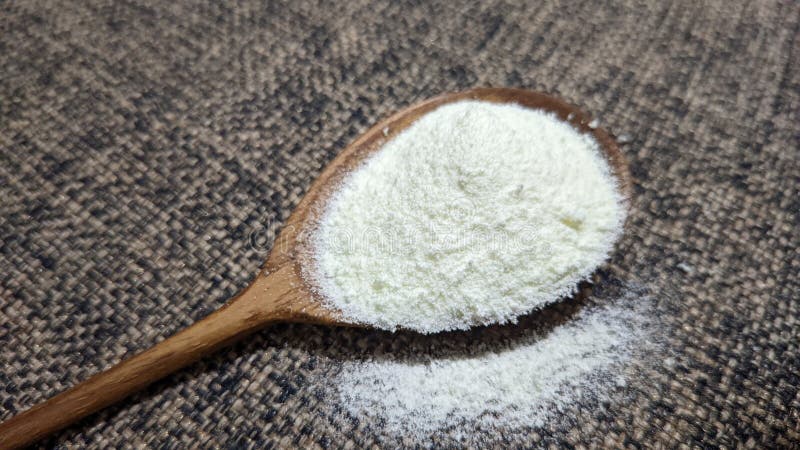Powdered Milk and a Wooden Spoon Stock Photo - Image of pastry, spoon ...