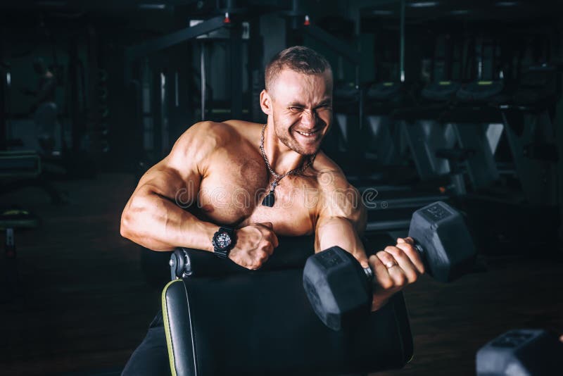 Power Athletic Guy Bodybuilder, Execute Exercise with Dumbbells, in ...