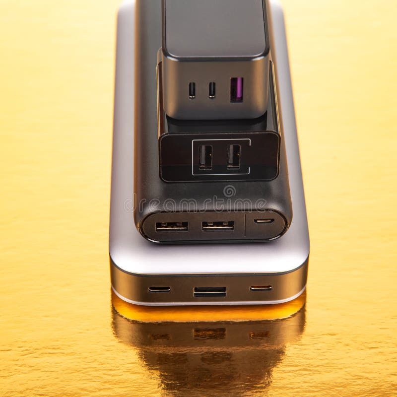 Power Bank and Charging Plug on a Golden Background. Electronic Devices ...