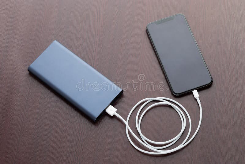 Power Bank and Smartphone on Wooden Table. Stock Photo - Image of ...