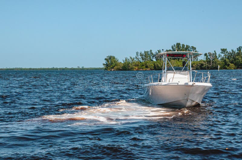 Power Boat, Backing Out of a Tropical Dock Stock Photo - Image of ...