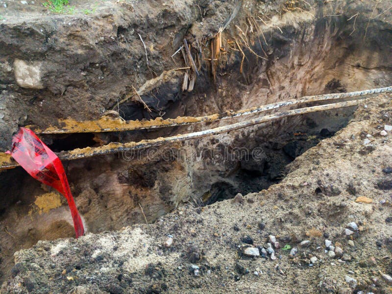 Power Cable Hanging Over a Trench in the Ground Stock Image - Image of ...