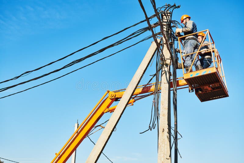 Power Electrician Lineman at Work on Pole Stock Photo - Image of ...