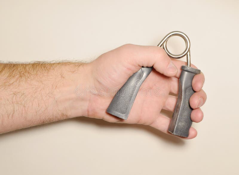 Power expander in hand stock photo. Image of active - 133279356
